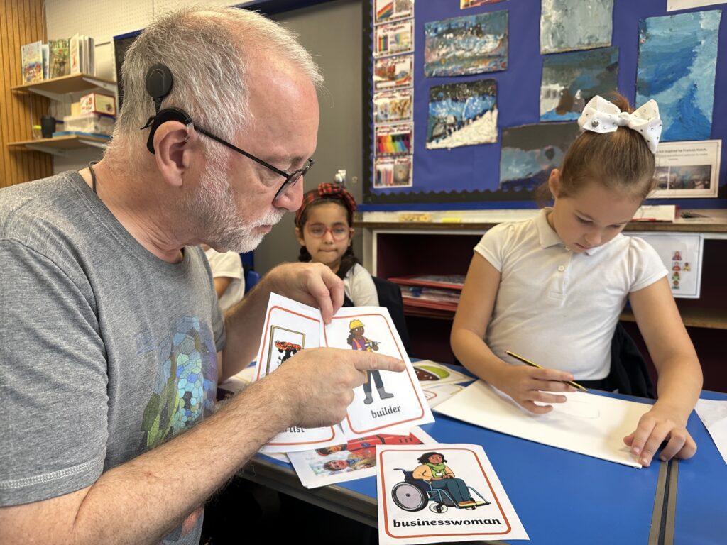Deaf photographer inspires deaf pupils they can do any career